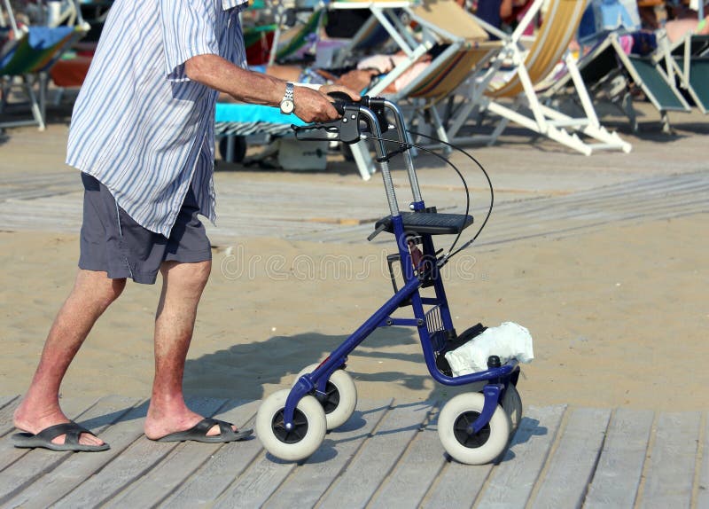 Senior Man Walking with Walker on the Beach in Summer Stock Image ...