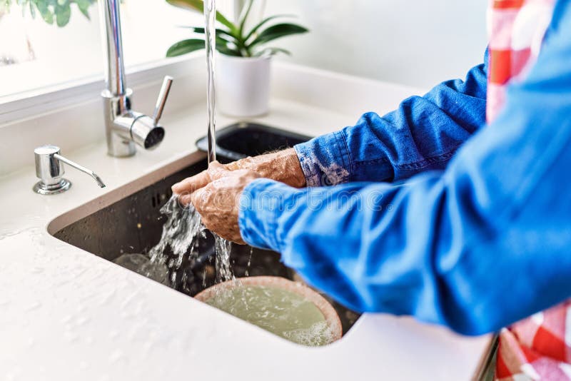 Senior Man Washing Hands at Kitchen Stock Photo - Image of senior ...