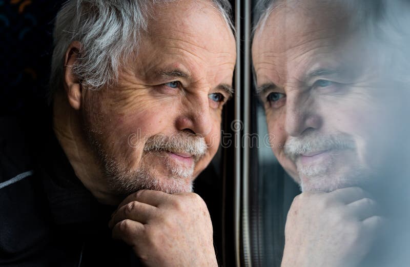 Senior Man Watching Out of the Window, Reflection in the Window ...