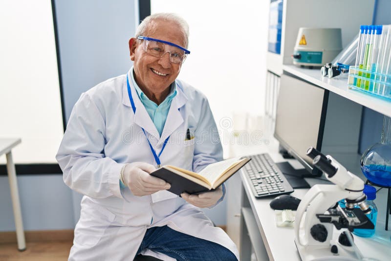 Senior Man Wearing Scientist Uniform Reading Book at Laboratory Stock ...