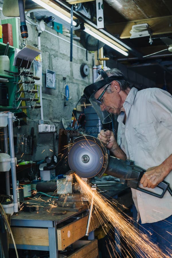 Senior Man Working with Angle Grinder Stock Image - Image of machine ...