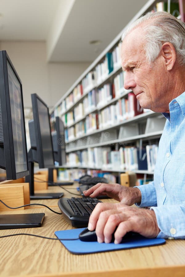 Senior Man Working on Computer in Library Stock Image - Image of male ...