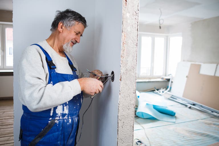 Senior Man Working on the Electrical Installations Stock Image - Image ...