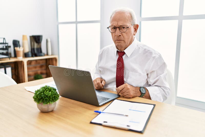 Senior Man Working at the Office Using Computer Laptop Depressed and ...