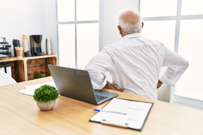 Senior Man Working at the Office Using Computer Laptop Standing ...