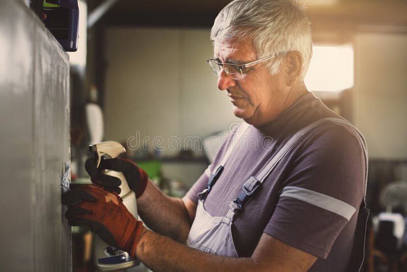 Senior man in workshop. stock photo. Image of caucasian - 99816322