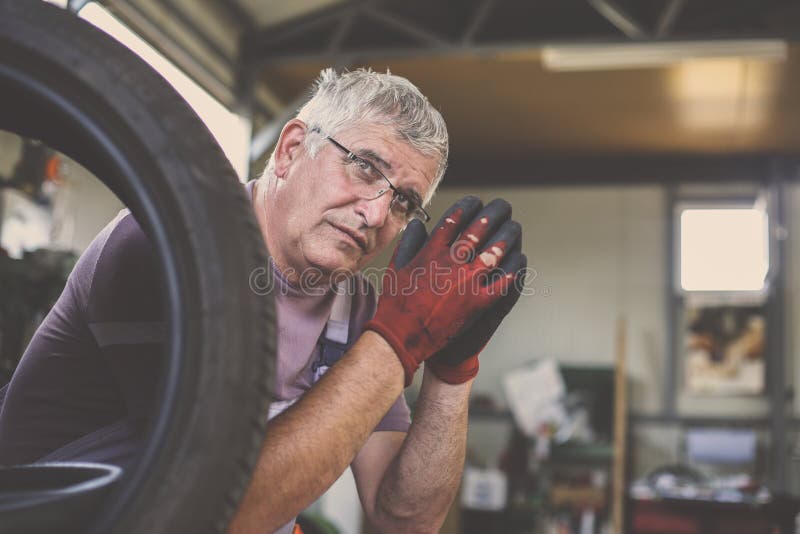 Senior man in workshop. stock photo. Image of indoors - 99816384