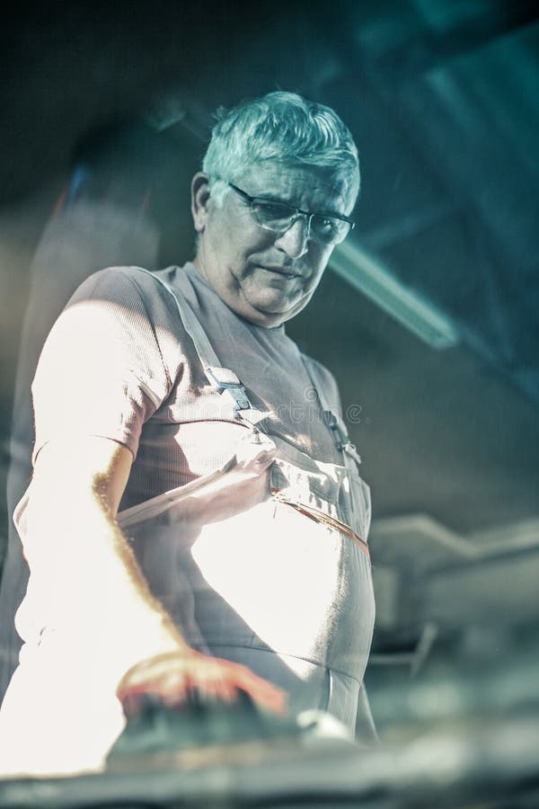 Senior man in workshop. stock image. Image of person - 100195419