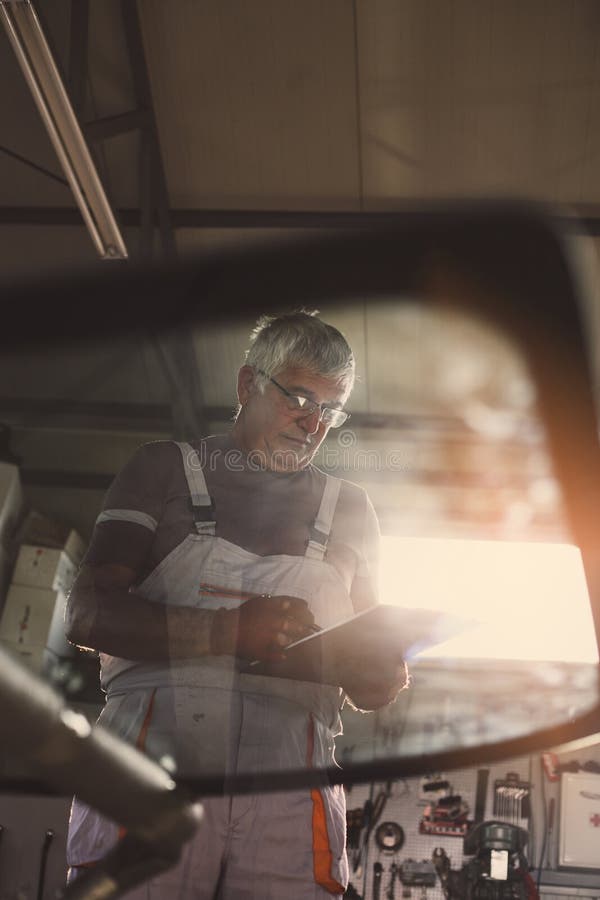Senior man in workshop. stock photo. Image of planning - 100194602