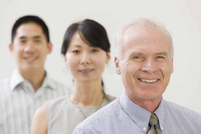 Senior manager with team stock photo. Image of fresh - 10946996