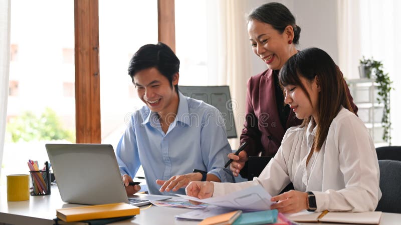 Senior Manager and Young Creative Team Brainstorming, Working Together ...