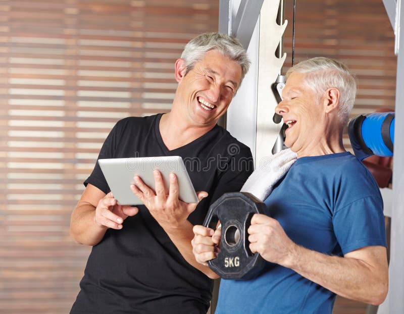 Senior Men Exercising in Gym Stock Photo - Image of back ...