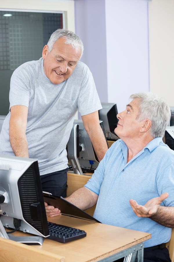 Senior Men Having Discussion in Computer Class Stock Image - Image of ...