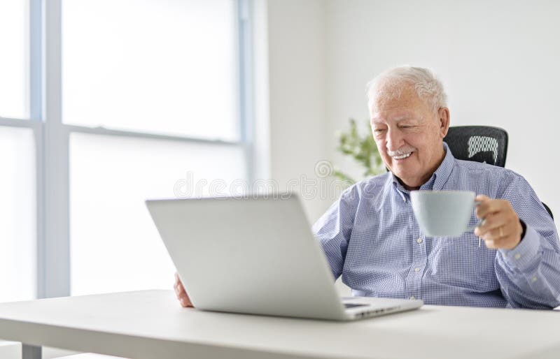 Senior Men Using a Laptop while Sitting at the Office Stock Photo ...