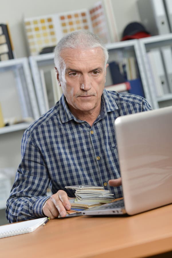 Senior Office Worker at Desk Stock Photo - Image of casual, confident ...