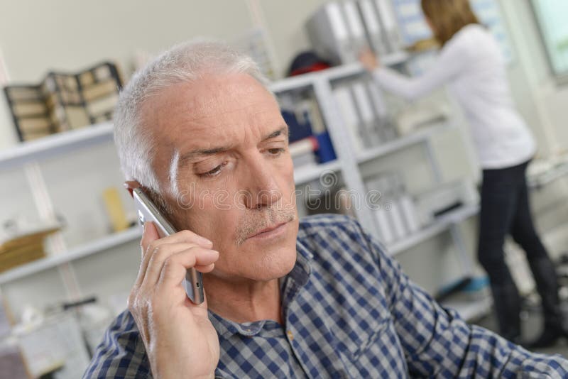 Senior Office Worker Taking Important Call Stock Photo - Image of ...