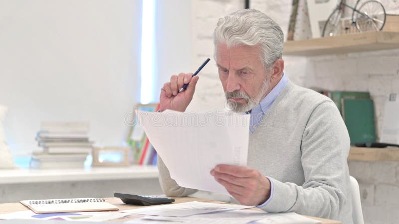 Senior Old Man Reading Documents at Work Stock Image - Image of book ...