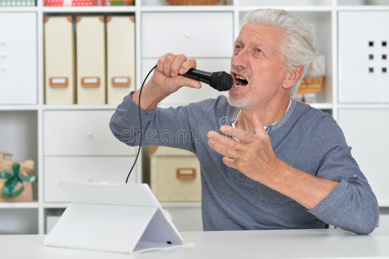 Senior Old Nice Man Singing into Microphone Stock Photo - Image of ...