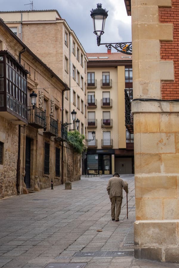 Senior Older Man Walking with Cane through Historic Street in Spanish ... Senior Older Man Walking with Cane through Historic Street in Spanish ...
