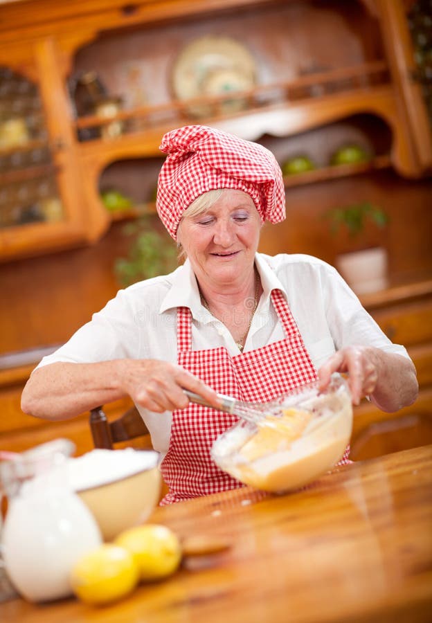 Senior or Older Woman Cooking in Kitchen Stock Image - Image of chef ...