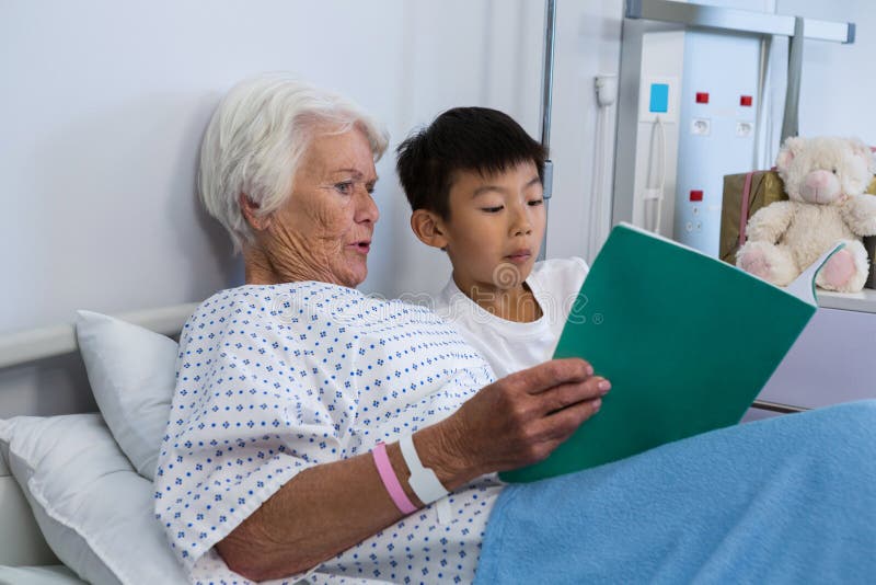 Senior Patient and Boy Reading a Book Stock Photo - Image of chinese ...