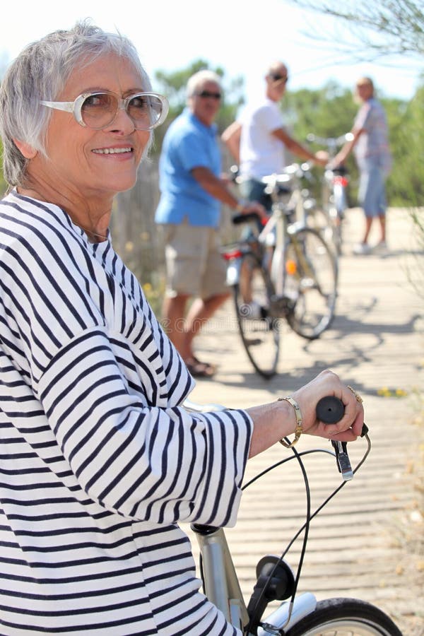 Senior people on bike ride stock photo. Image of path - 31131638