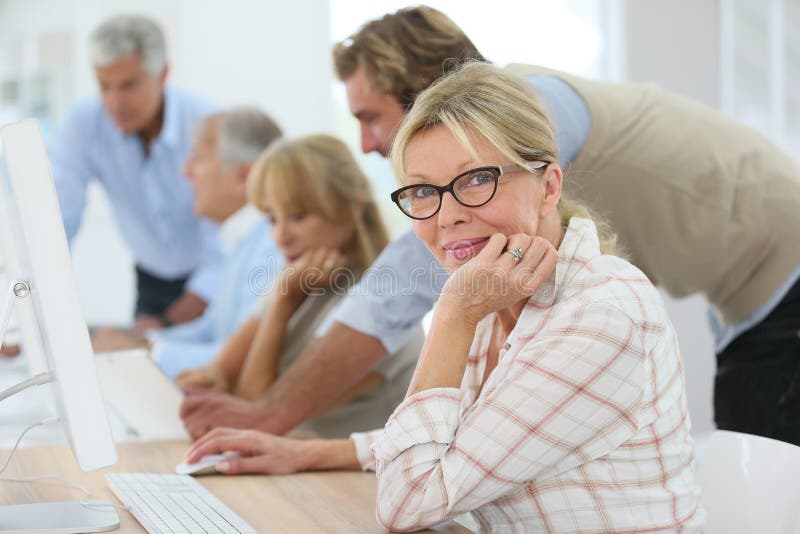 Adult Students on a Computer Stock Photo - Image of fifties, looking ...