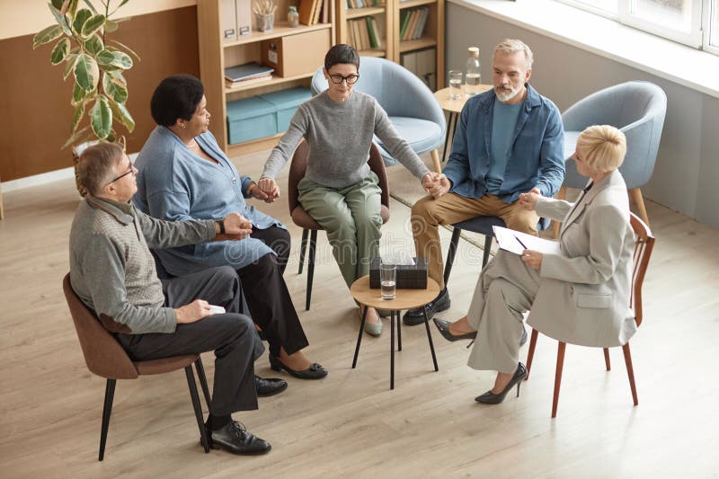 Senior People Holding Hands in Therapy Session Stock Photo - Image of ...