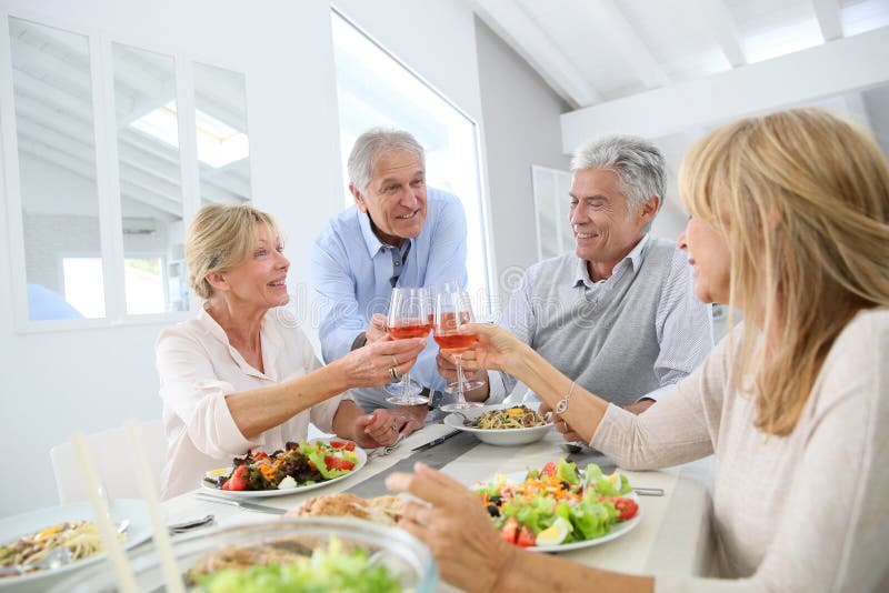 Senior People Making Toast at Lunch Stock Image - Image of laughing ...