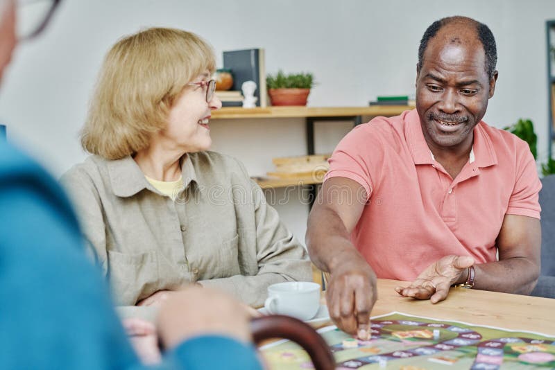 Senior People Playing Game at Table Stock Image - Image of ...