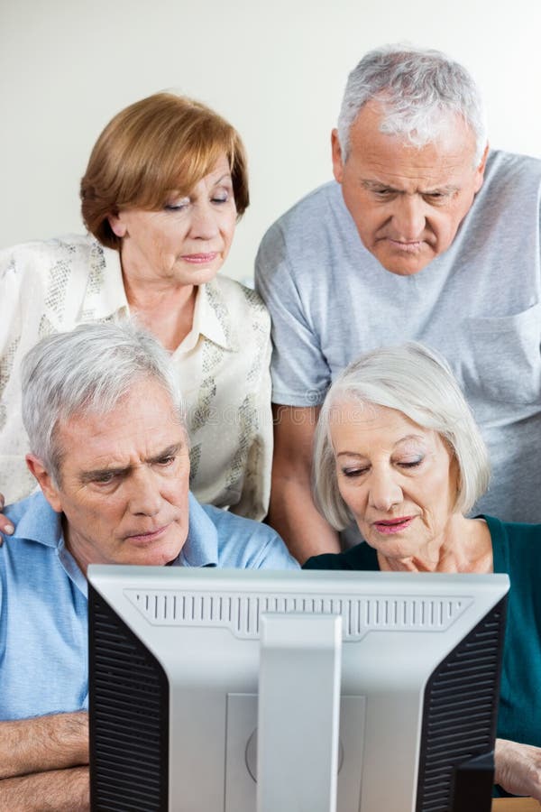 Senior People Using Computer Together in Classroom Stock Photo - Image ...