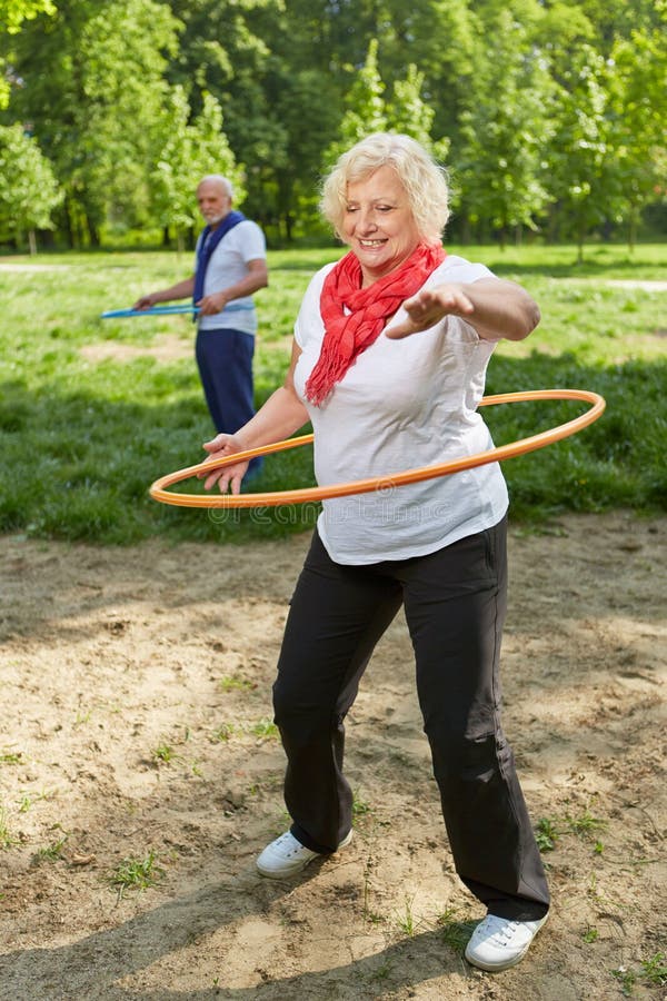 Senior People Using Hoops in a Park Stock Photo - Image of people ...