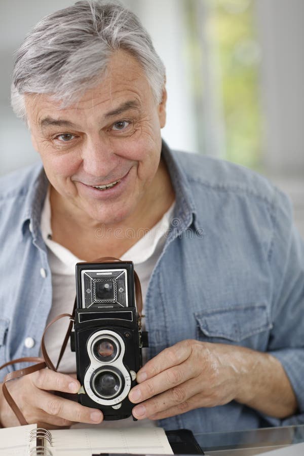 Senior Photographer Using Vintage Camera Stock Photo - Image of casual ...
