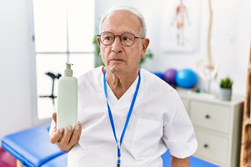 Senior Physiotherapy Man Holding Massage Body Lotion Thinking Attitude ...