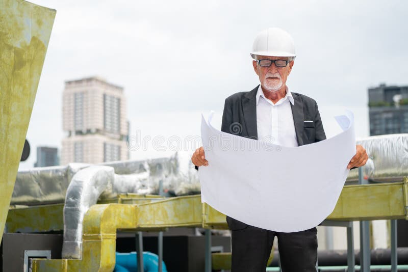 Senior Professional Engineer or Technician Use Building Drawing Plan To ...