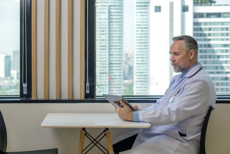 Senior Professor with Mustache and Beard Typing on Tablet Computer ...