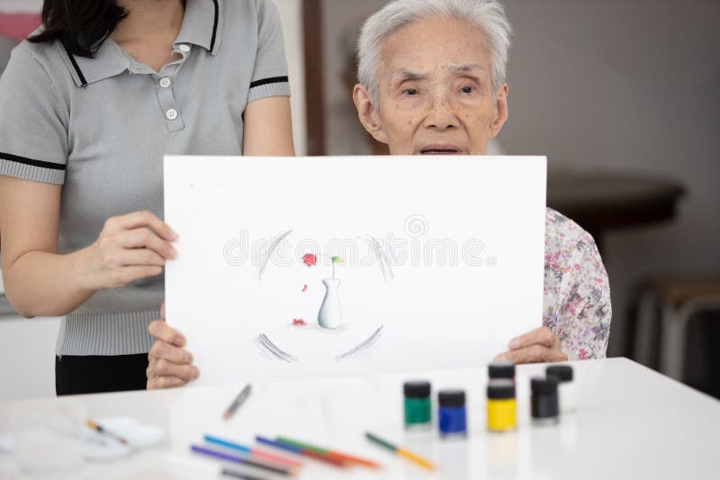 Senior Proudly Shows Her Painting Work,build Self-esteem from the Work ...