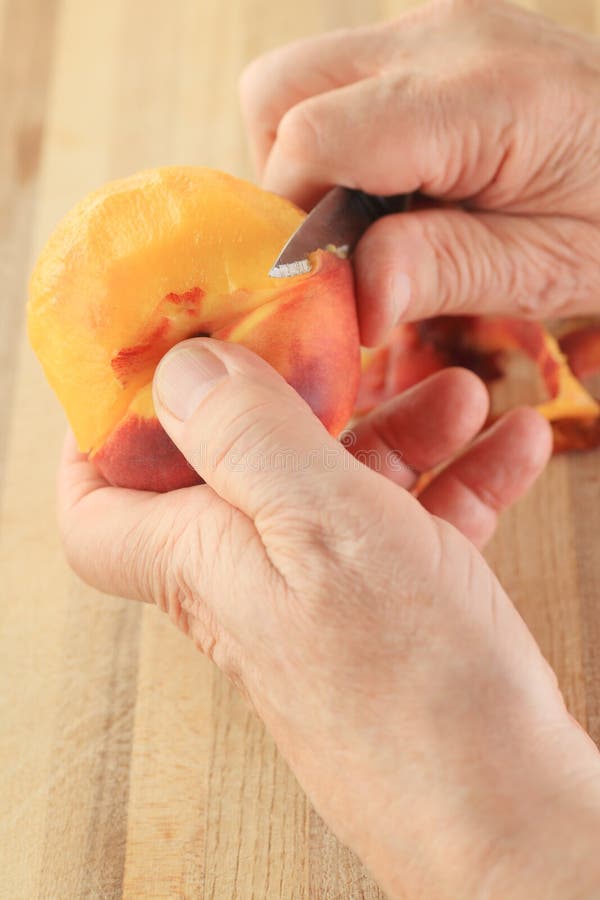 Senior Removes Peel from Peach Stock Photo - Image of preparation, peel ...
