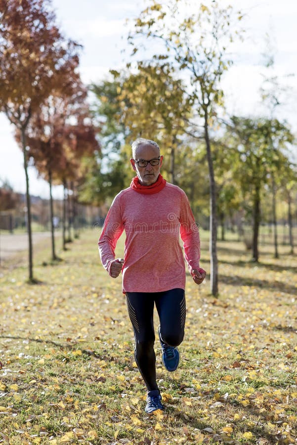 Senior Retired Man Runs and Performs Exercise Stock Image - Image of ...