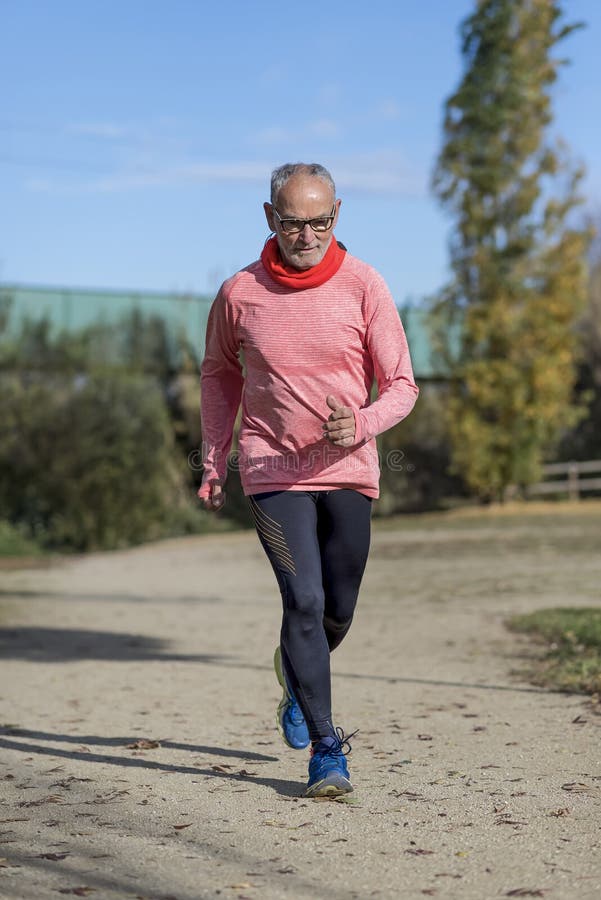 Senior Retired Man Runs and Performs Exercise Stock Image - Image of ...