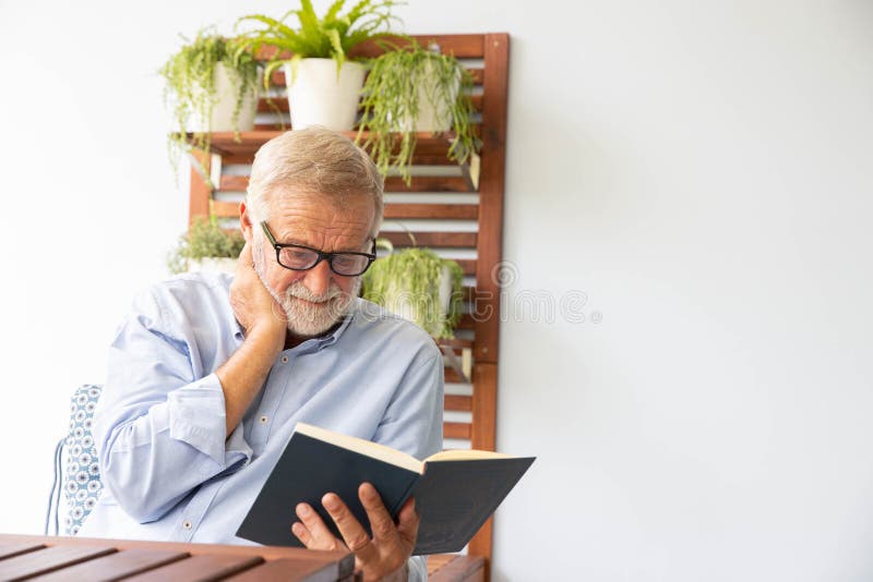 Senior Retirement Man Happy Reading Book at Home Stock Photo - Image of ...