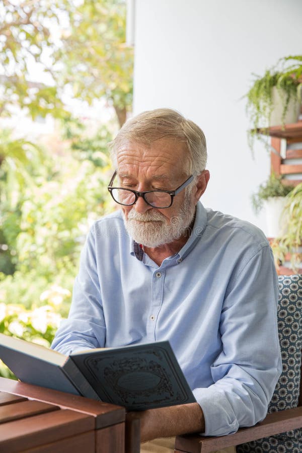 Senior Retirement Man Happy Reading Book at Home Stock Photo - Image of ...