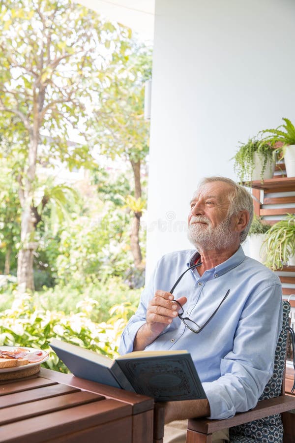 Senior Retirement Man Happy Reading Book at Home Stock Photo - Image of ...