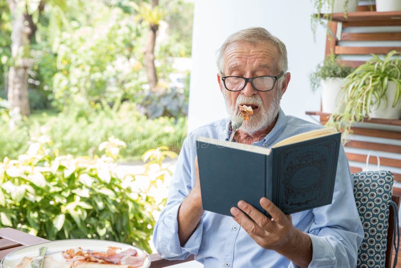 Senior Retirement Man Happy Reading Book at Home Stock Photo - Image of ...