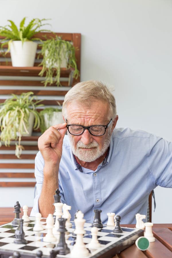 Senior Retirement Man Playing Chess with Himself at Home Stock Image ...