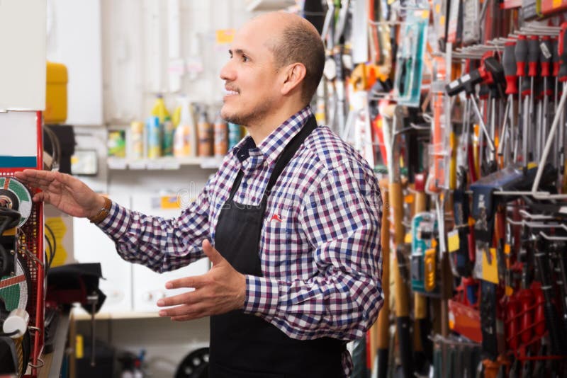 Senior Salesman with Screwdrivers and Palette Knives Stock Photo ...