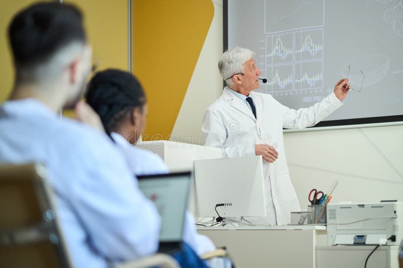 Senior Scientist Giving Lecture Modern Classroom Stock Photos - Free ...