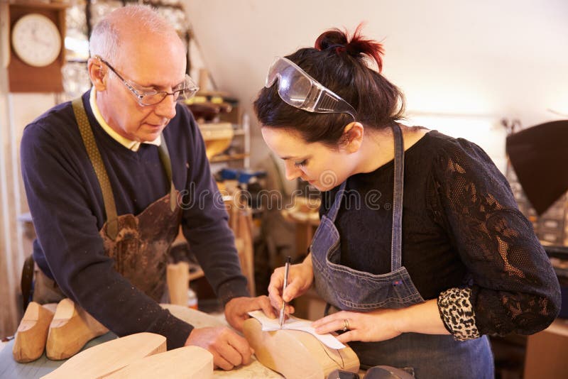 Senior Shoemaker Training Apprentice To Make Shoe Lasts Stock Photo ...