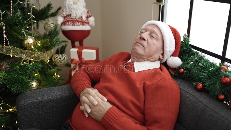 Senior Sleeping on Sofa by Christmas Tree at Home Stock Photo - Image ...