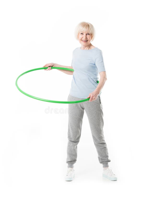 Senior Sportswoman Doing Hula Hoop Exercise Stock Photo - Image of ...